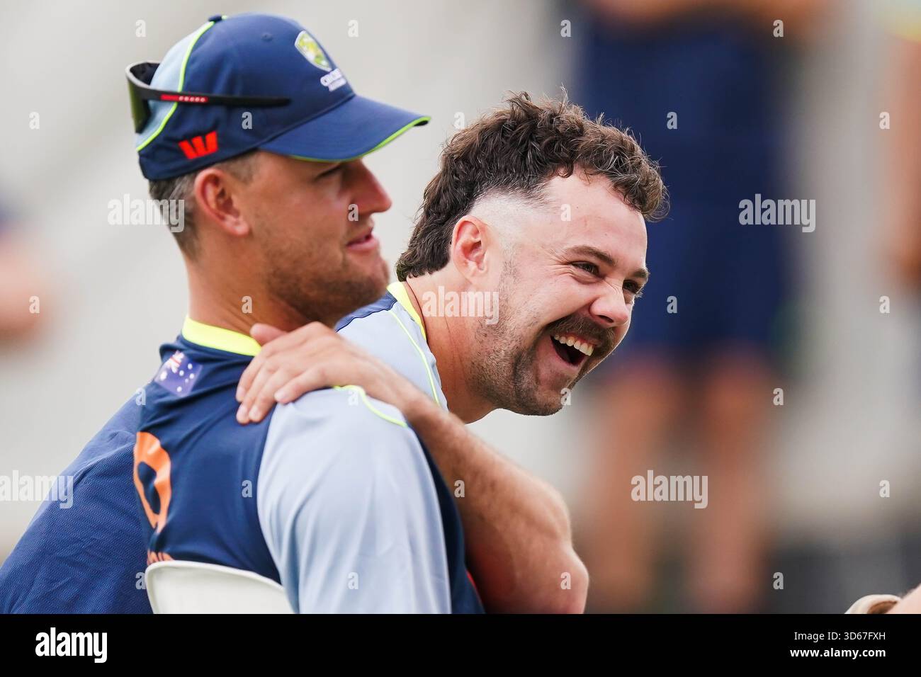Australia's Travis Head (right) and Beau Webster (left) share a joke ...