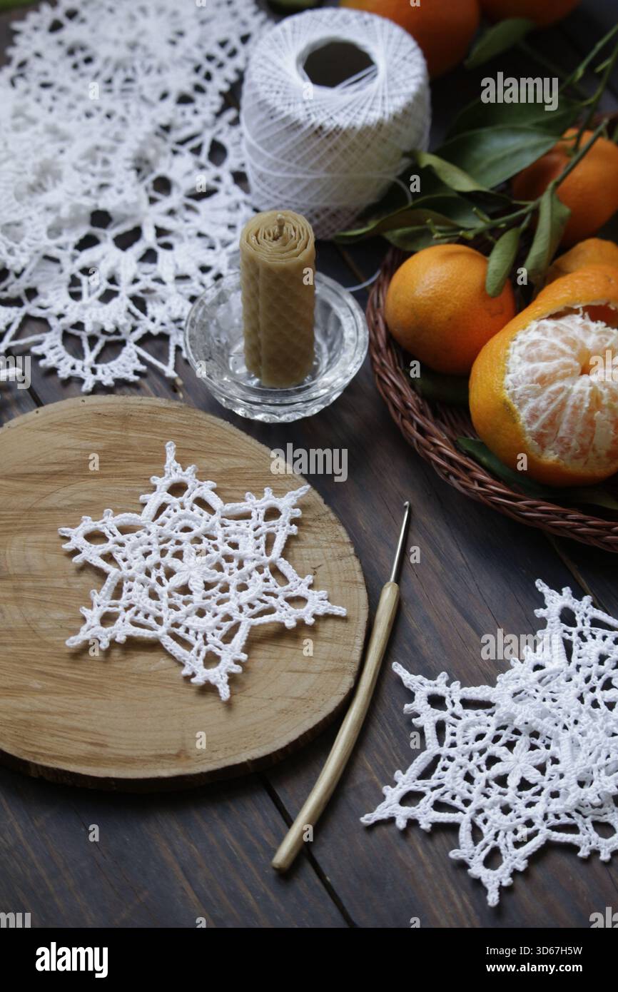 Handmade crocheted white snowflake, crochet hook, natural beeswax ...