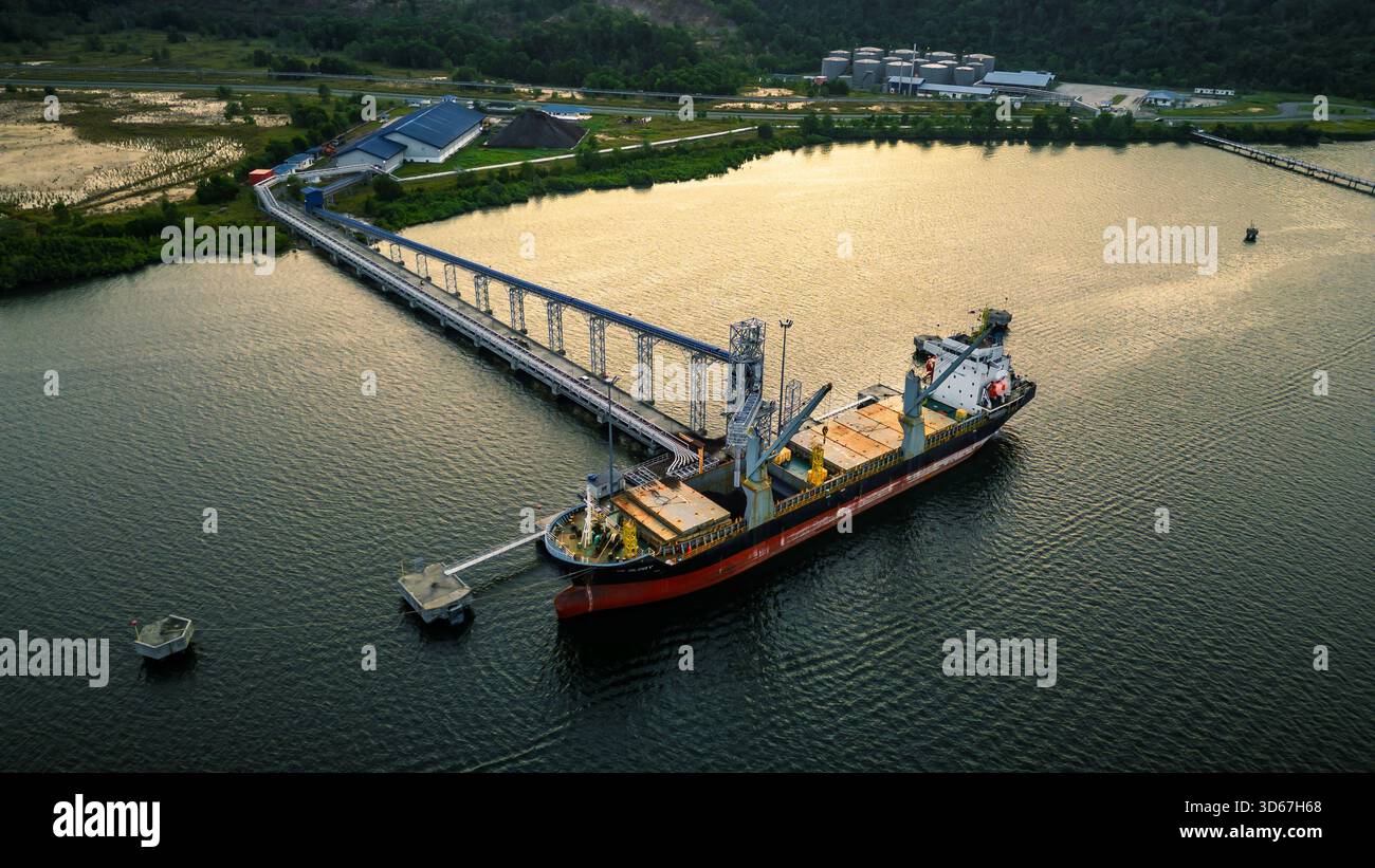 Ship loading at the Sawit port in Sandakan, Sabah, Borneo. From here ...