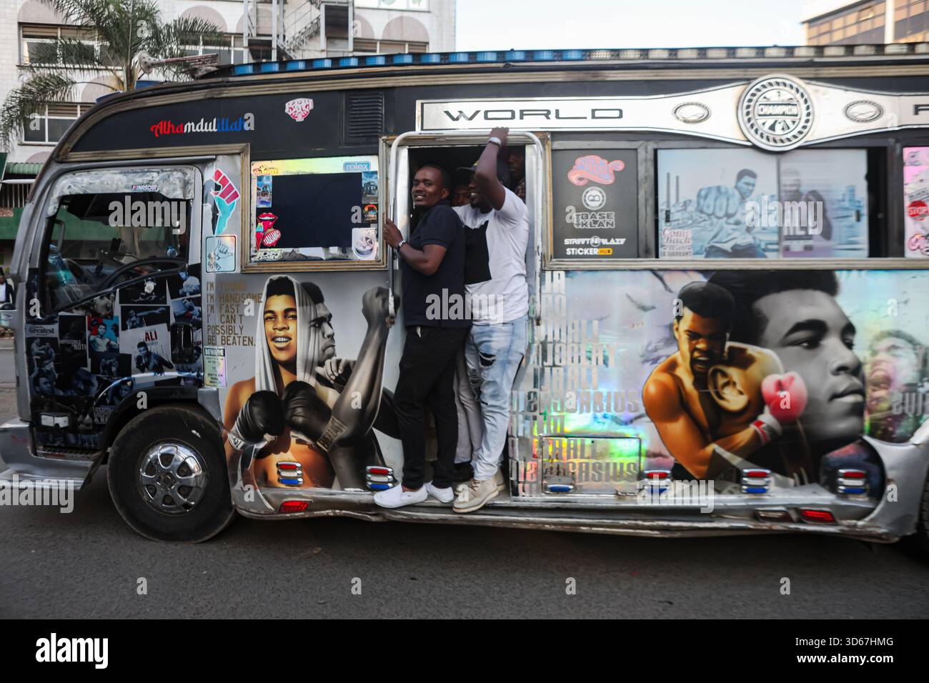 December 11, 2024, Nairobi, Kenya: Matatu conductors hang on the door ...