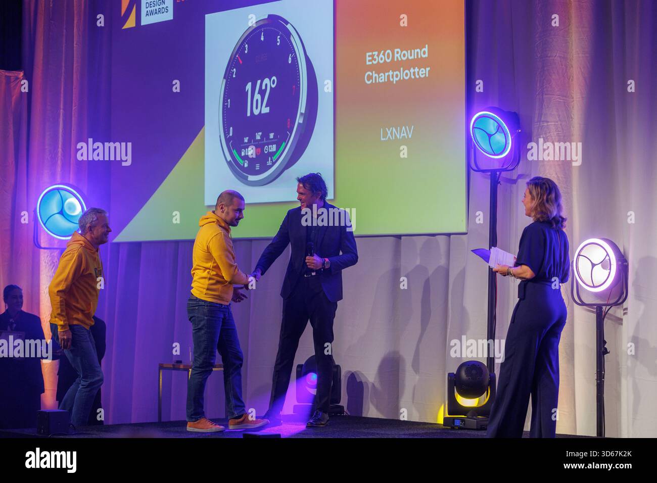 A representative of LXNAV receives an award for the E360 Round Chartplotter during the DAME ...