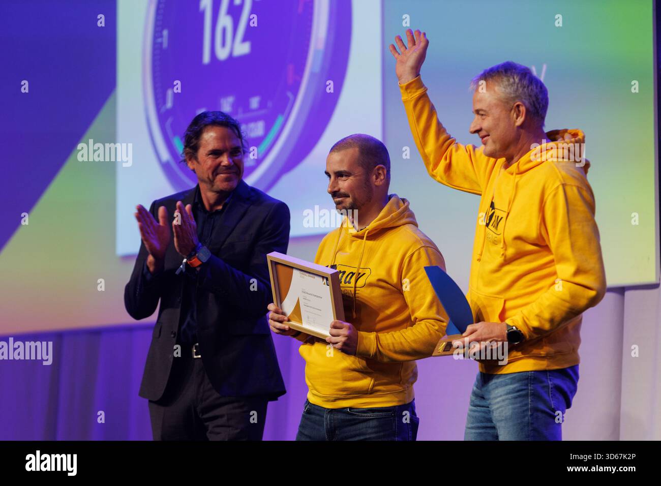 A representative of LXNAV receives an award for the E360 Round Chartplotter during the DAME ...