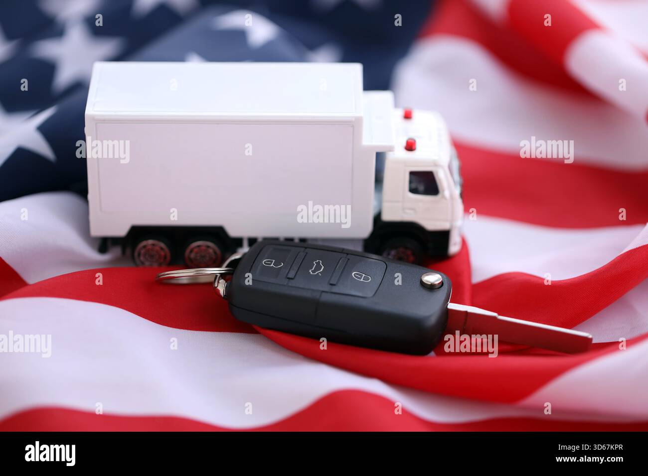 Ignition keys with remote control buttons and toy truck on United ...
