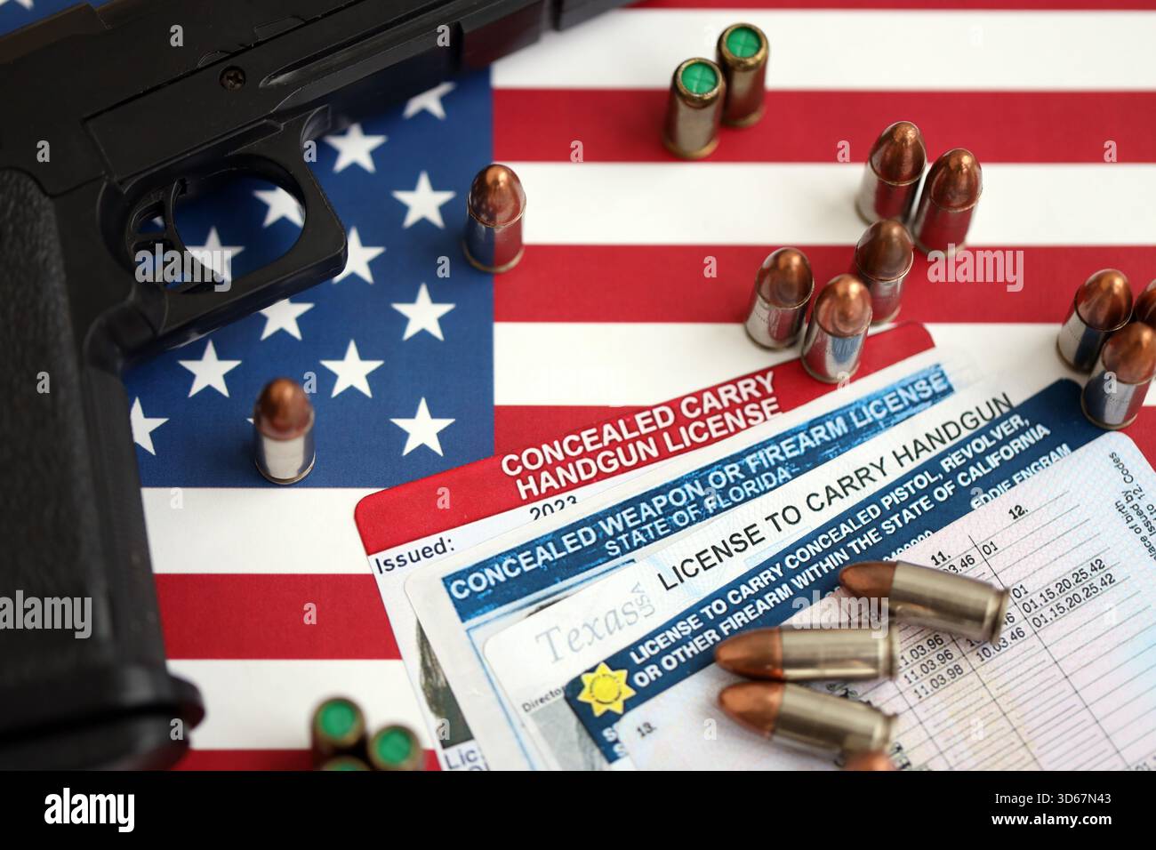 USA firearms license and handgun with bullets on US flag close up. Gun ...