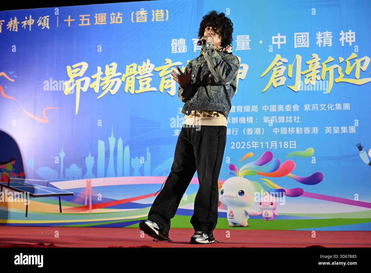 Mike Tsang Pei-tak, a Hong Kong singer signing a song at an event on ...