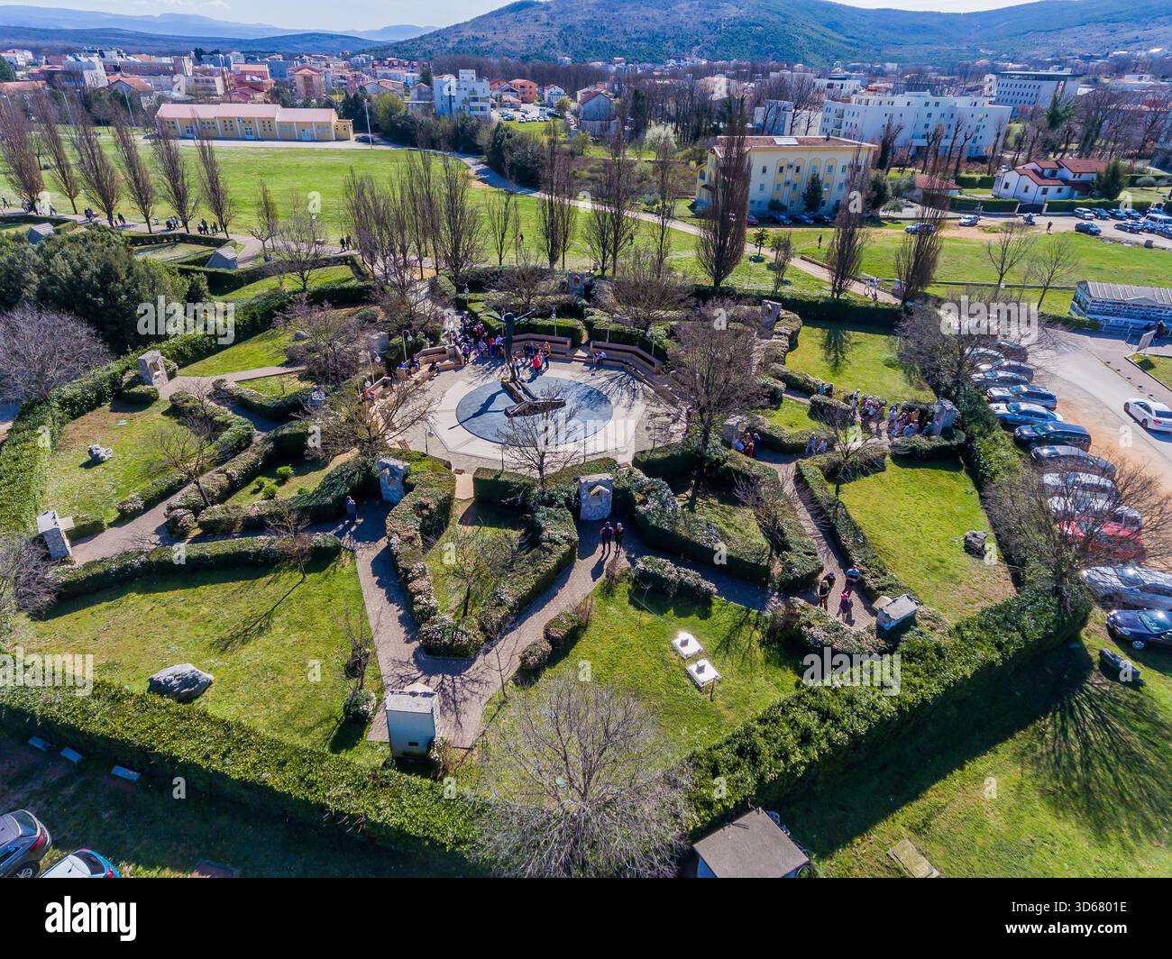 Aerial view of a star-shaped garden with trimmed hedges and a central ...