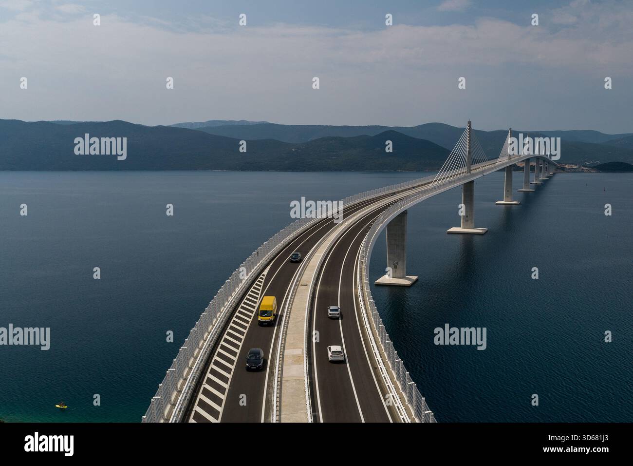 Aerial view of the Pelješac Bridge gracefully stretches across the ...