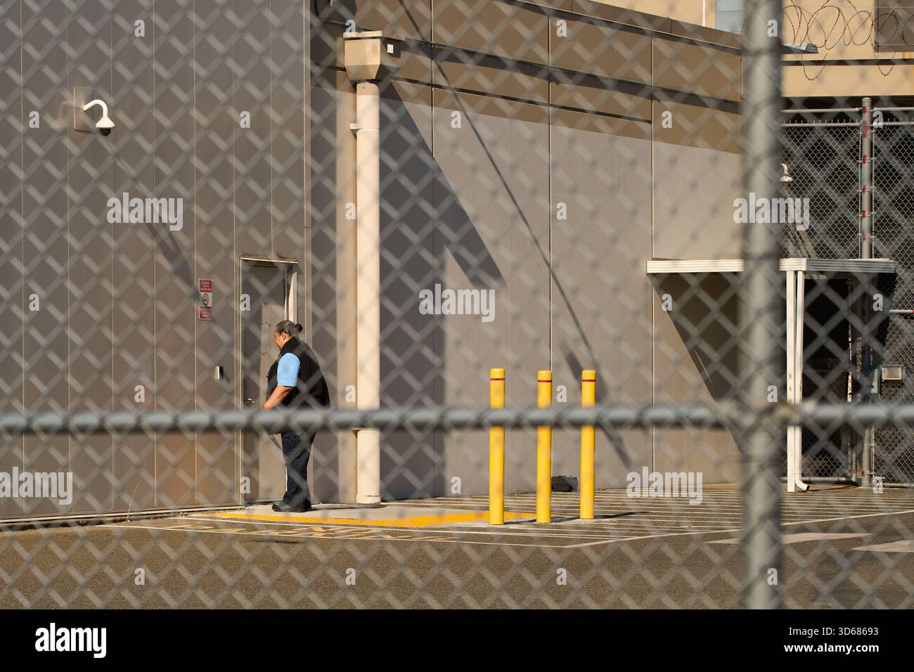 A GEO Group employee enters a building at the Northwest ICE Processing ...