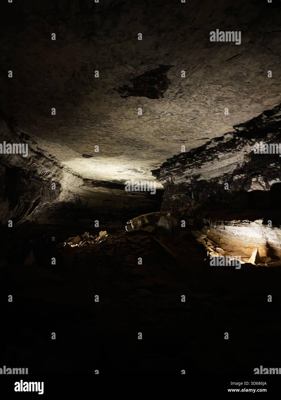 Low light underground scene inside Mammoth Cave showing rugged rock ...