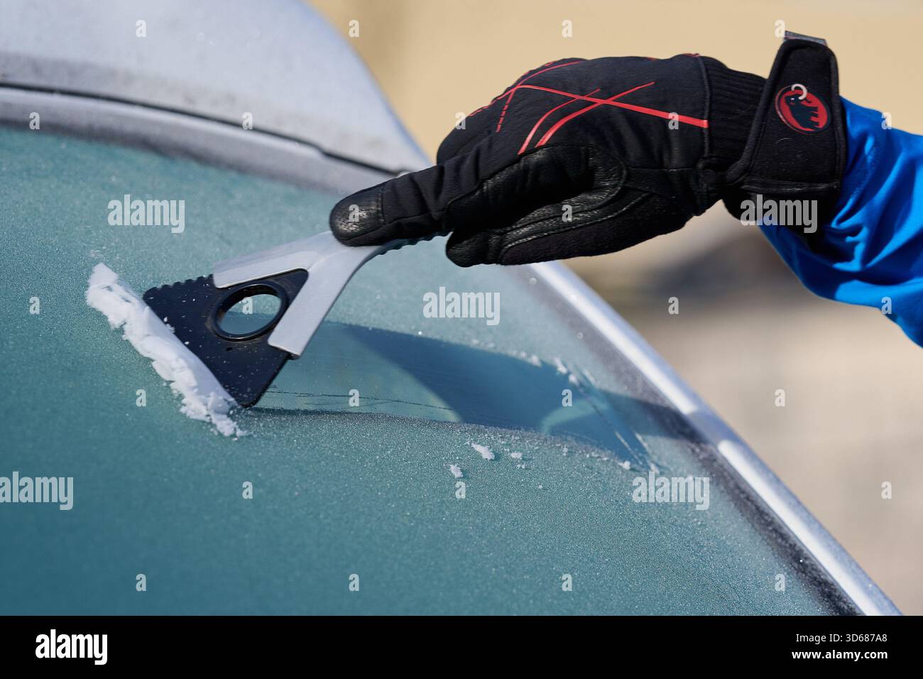 Berchtesgaden, Germany 19.11.2025: In the picture: Ice scraping on a ...