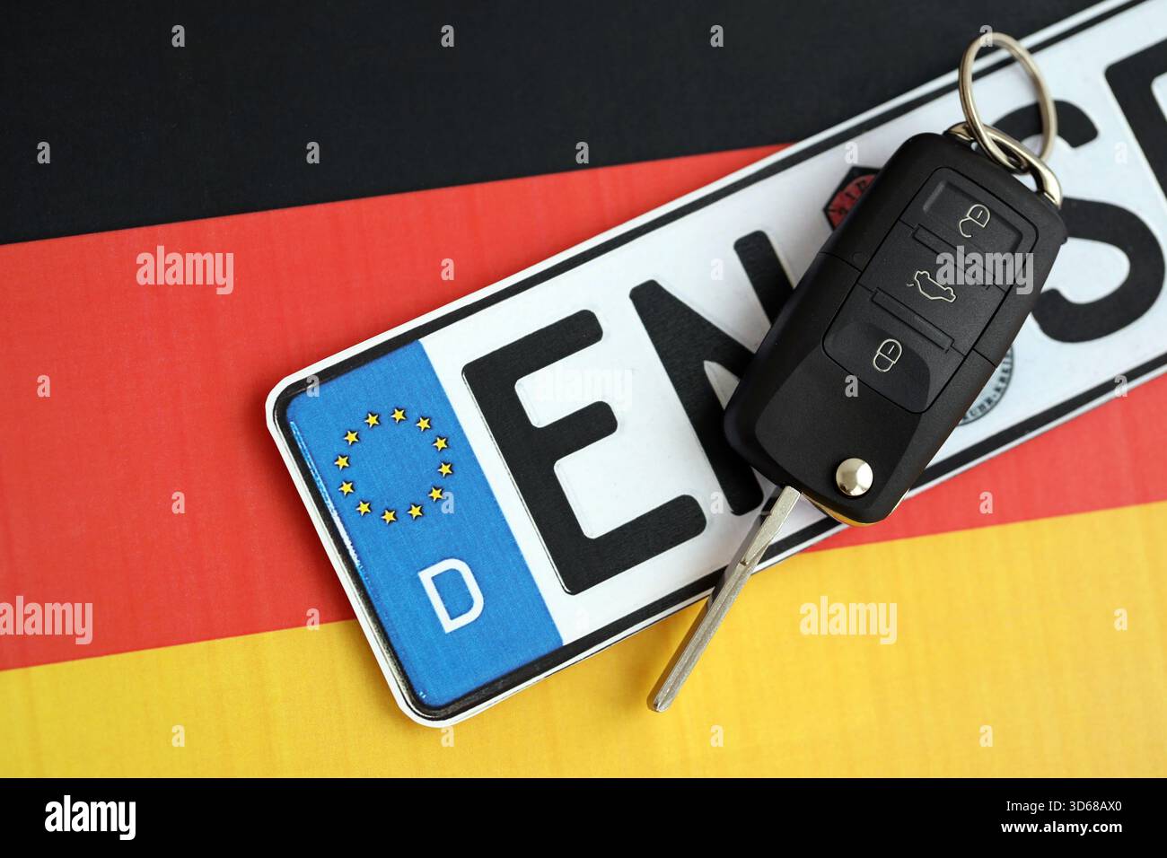 Germany Deutschland car license plate and key on german flag close up ...