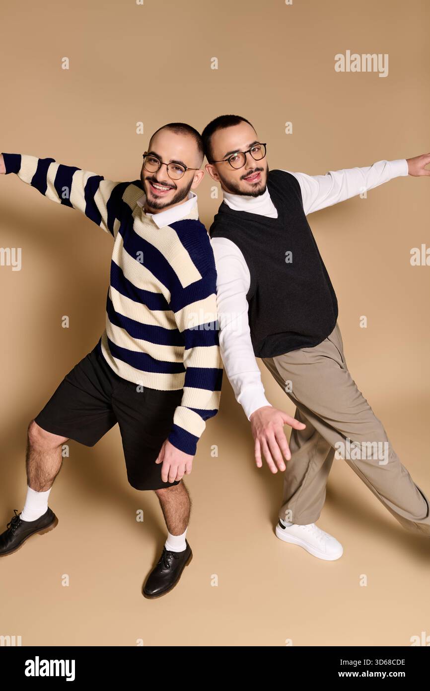 Two handsome twin brothers showcase their fashion sense while having ...
