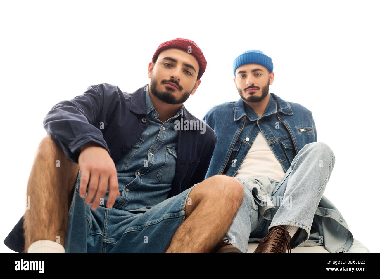 Twin brothers showcase their fashion sense while striking relaxed poses ...