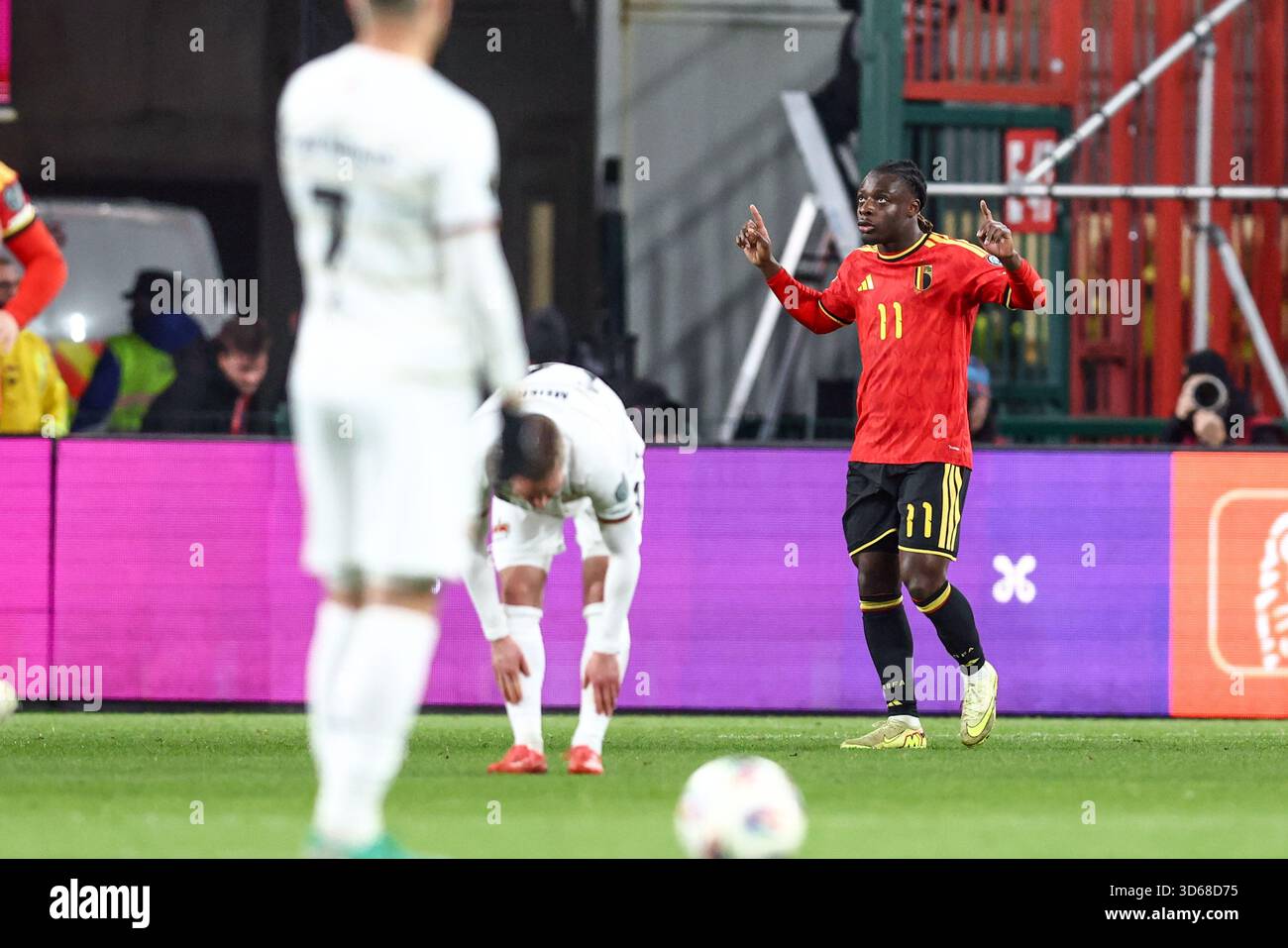 Belgium's Jeremy Doku celebrates after scoring during a soccer game ...