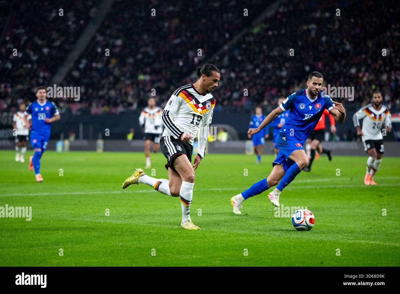 Leroy Sane (Germany, #19) on the ball, behind David Hancko (Slovakia ...