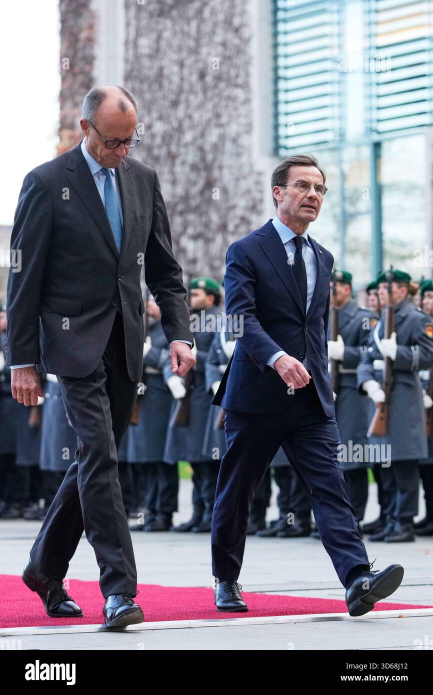 German Chancellor Friedrich Merz, left, welcomes the Prime Minister ...