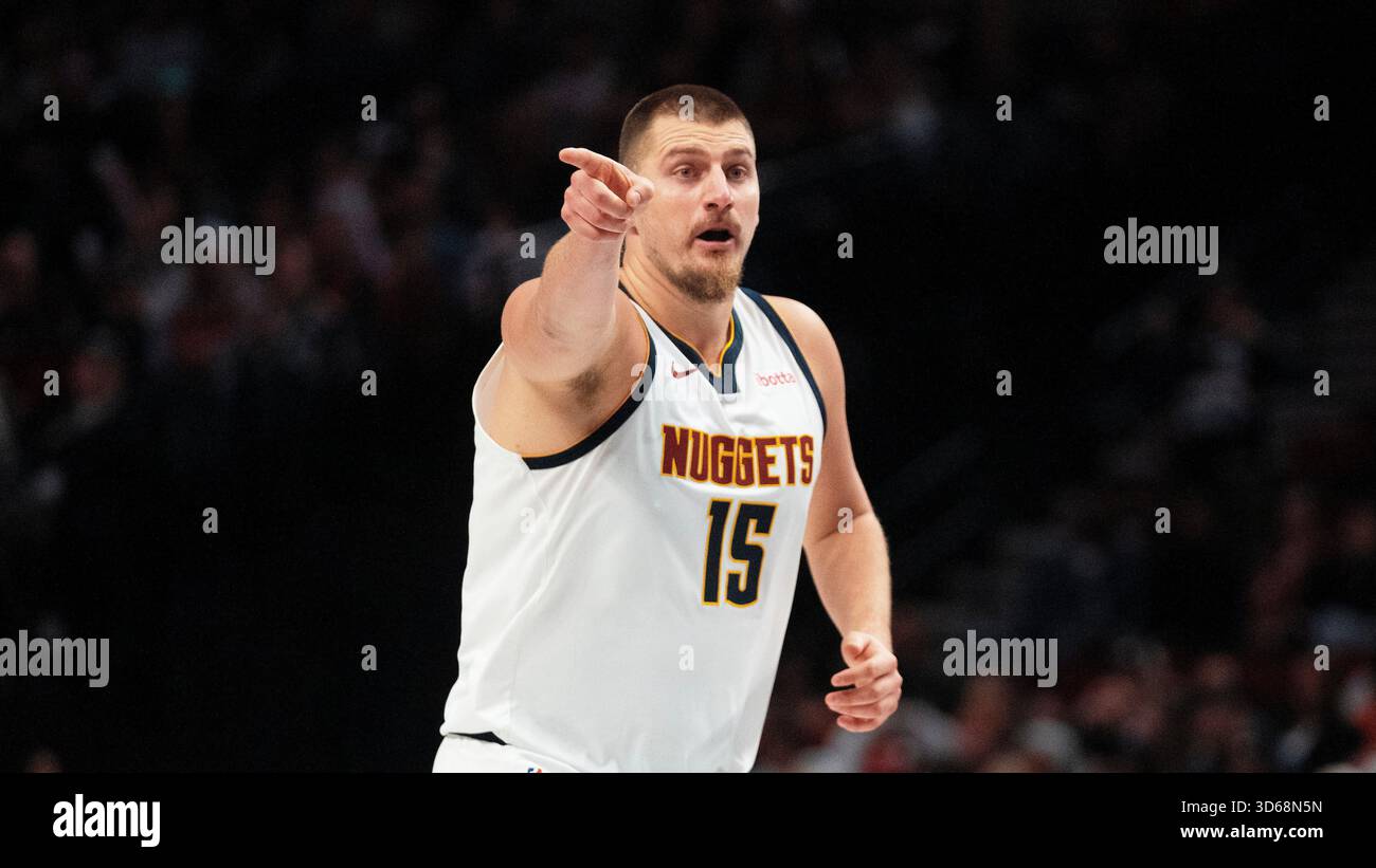 Denver Nuggets center Nikola Jokić (15) points towards his teammates ...