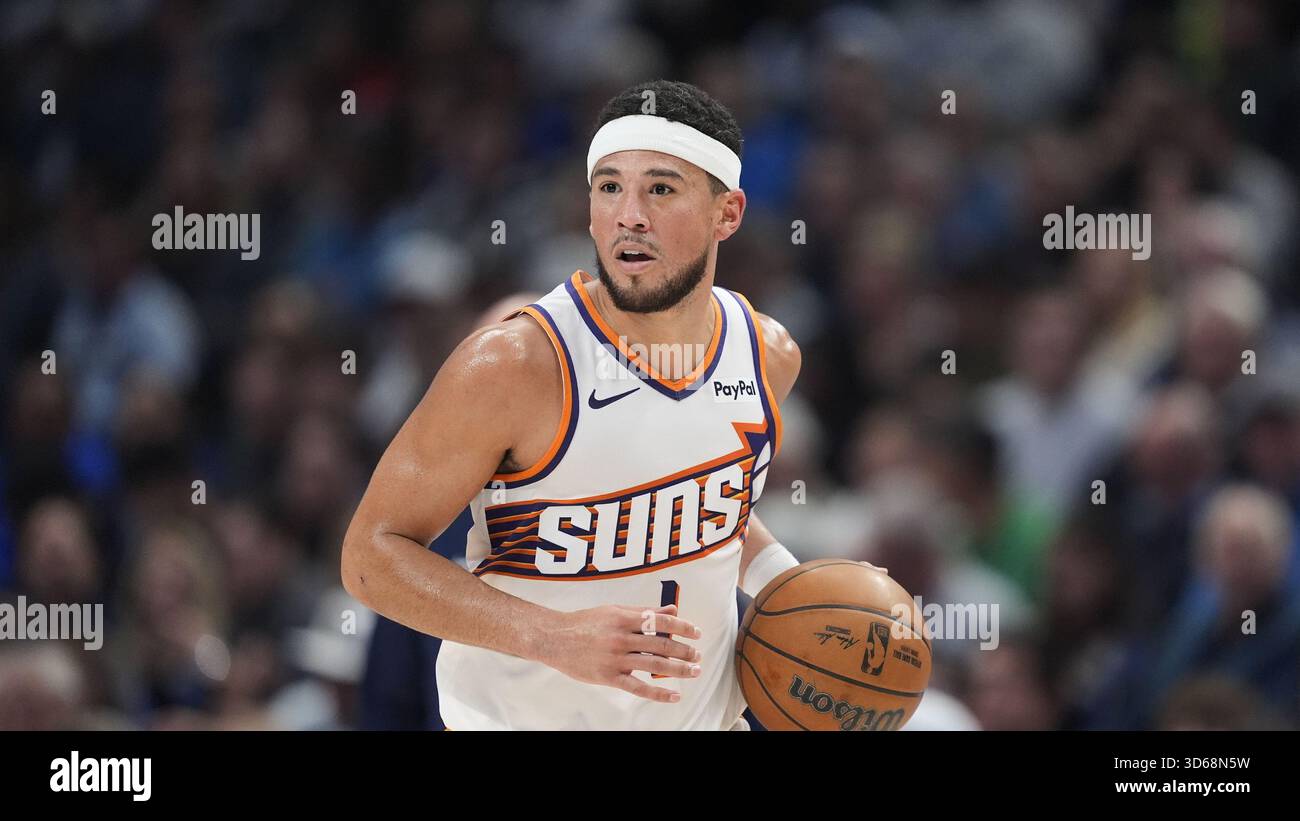 Phoenix Suns' Devin Booker handles the ball during an NBA basketball ...