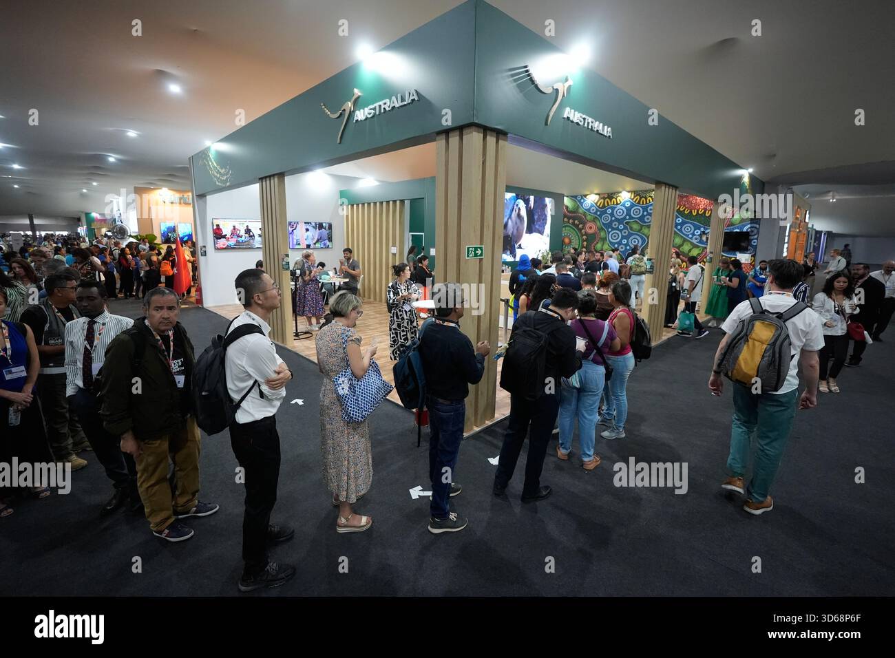People line up at the Australia Pavilion with the Turkey Pavilion, back ...