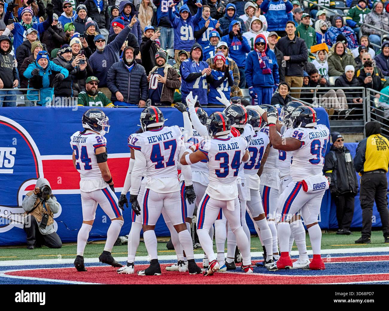 The New York Giants defense celebrate a fumble recovery by cornerback ...