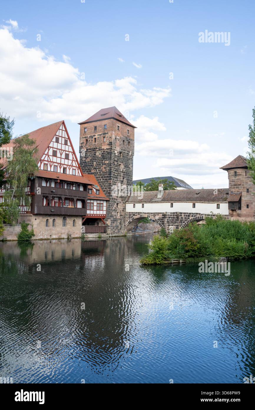 Picturesque view of Henkerhaus Museum, Wasserturm, and the Henkersteg ...