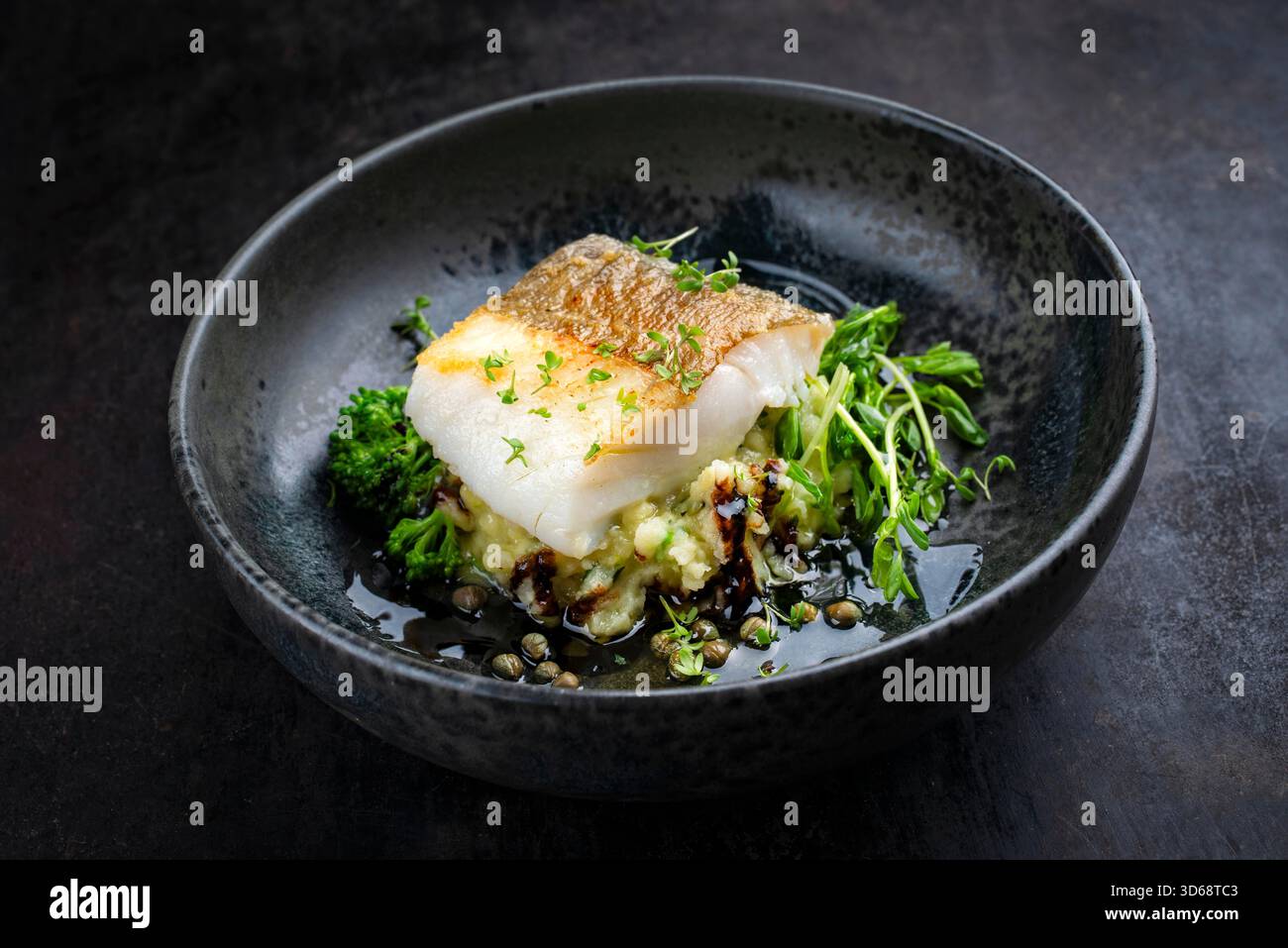 Fried nordic skrei cod white sea fish filet with mashed potatoes, green ...