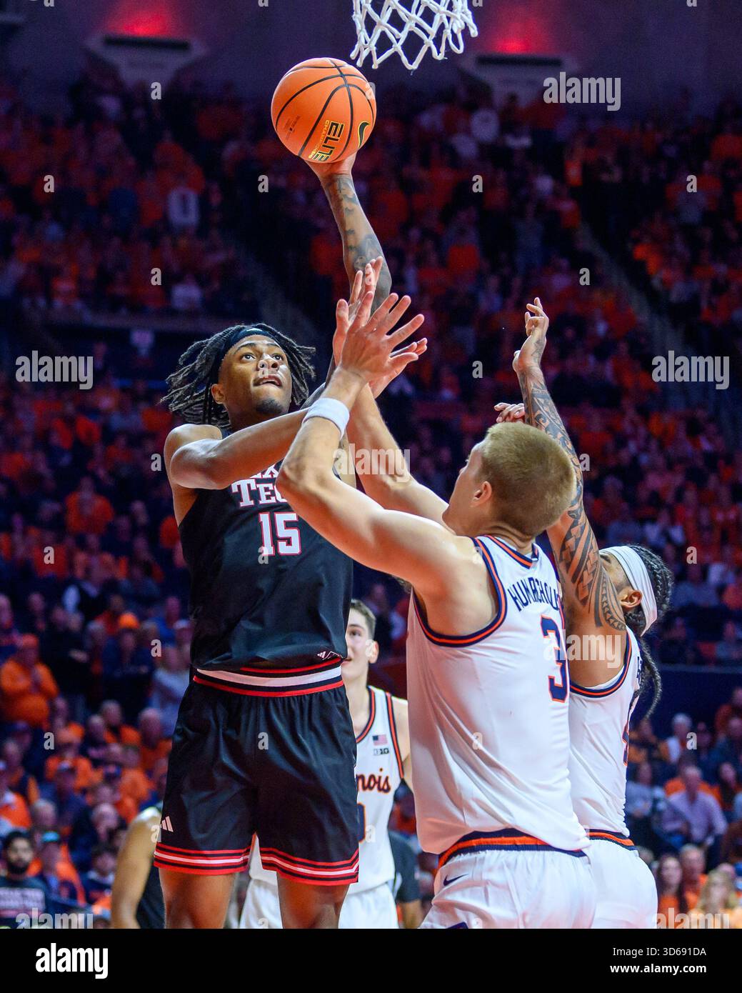 Texas Tech's JT Toppin shoots over Illinois' Ben Humrichous (3) and ...