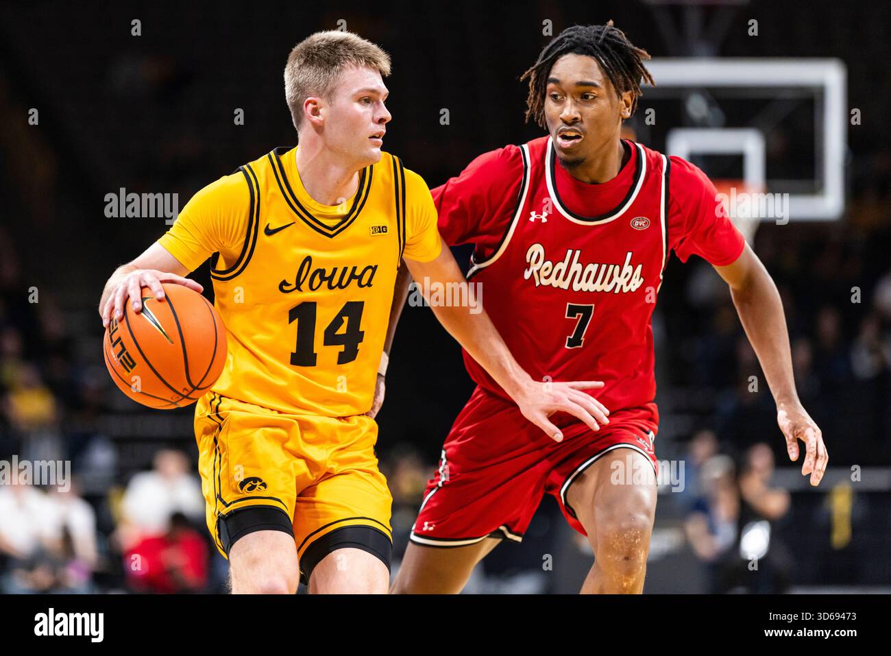 Iowa Hawkeyes guard Bennett Stirtz (14) dribbles as SEMO Redhawks guard ...