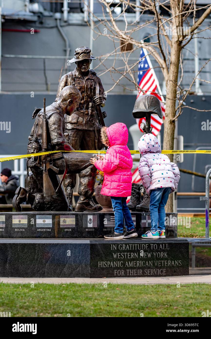 Two children explore a military monument in Buffalo NY Stock Photo - Alamy