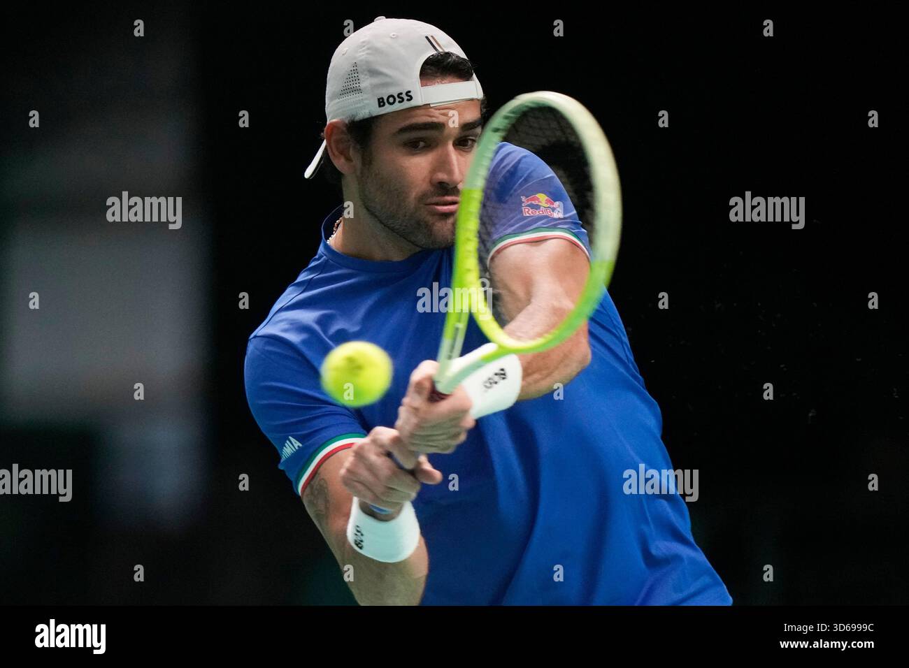 Italy's Matteo Berrettini returns the ball to Austria's Jurij Rodionov ...