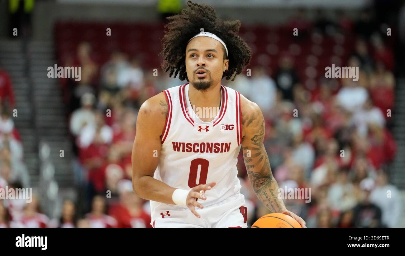 Wisconsin guard Braeden Carrington dribbles the ball during the second ...