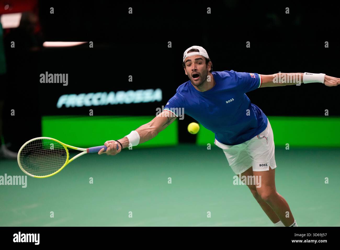 Italy's Matteo Berrettini returns the ball to Austria's Jurij Rodionov ...