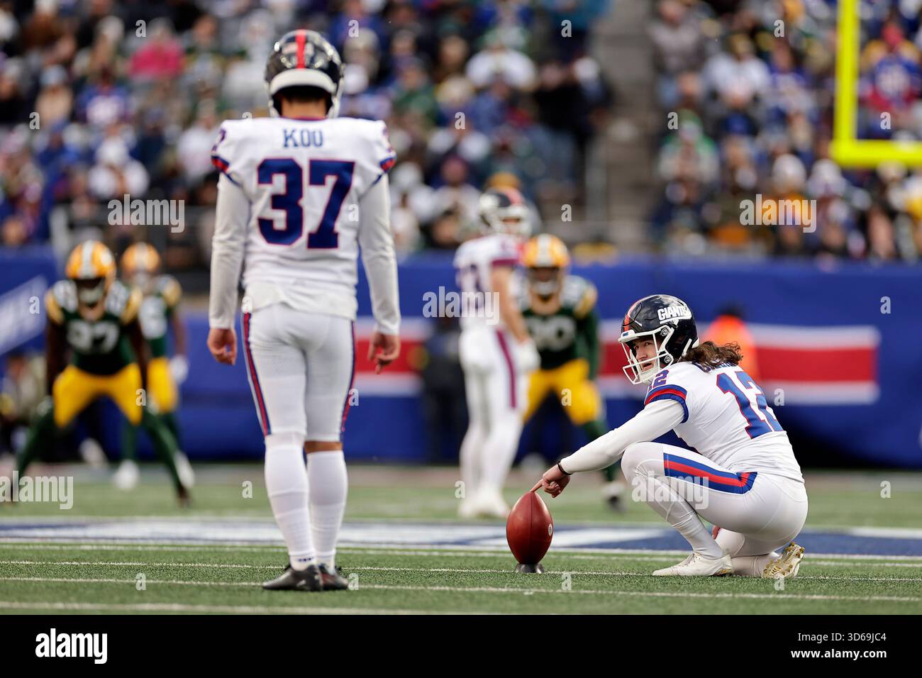 New York Giants punter Jamie Gillan (12) holds the ball for kickoff for ...
