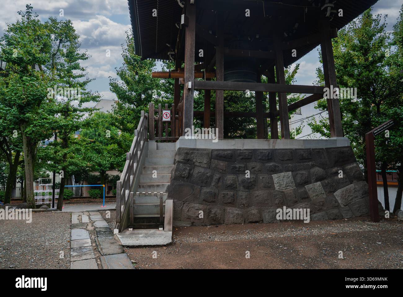 Temple bell tower on stone base with steps in Tokyo shrine Stock Photo ...
