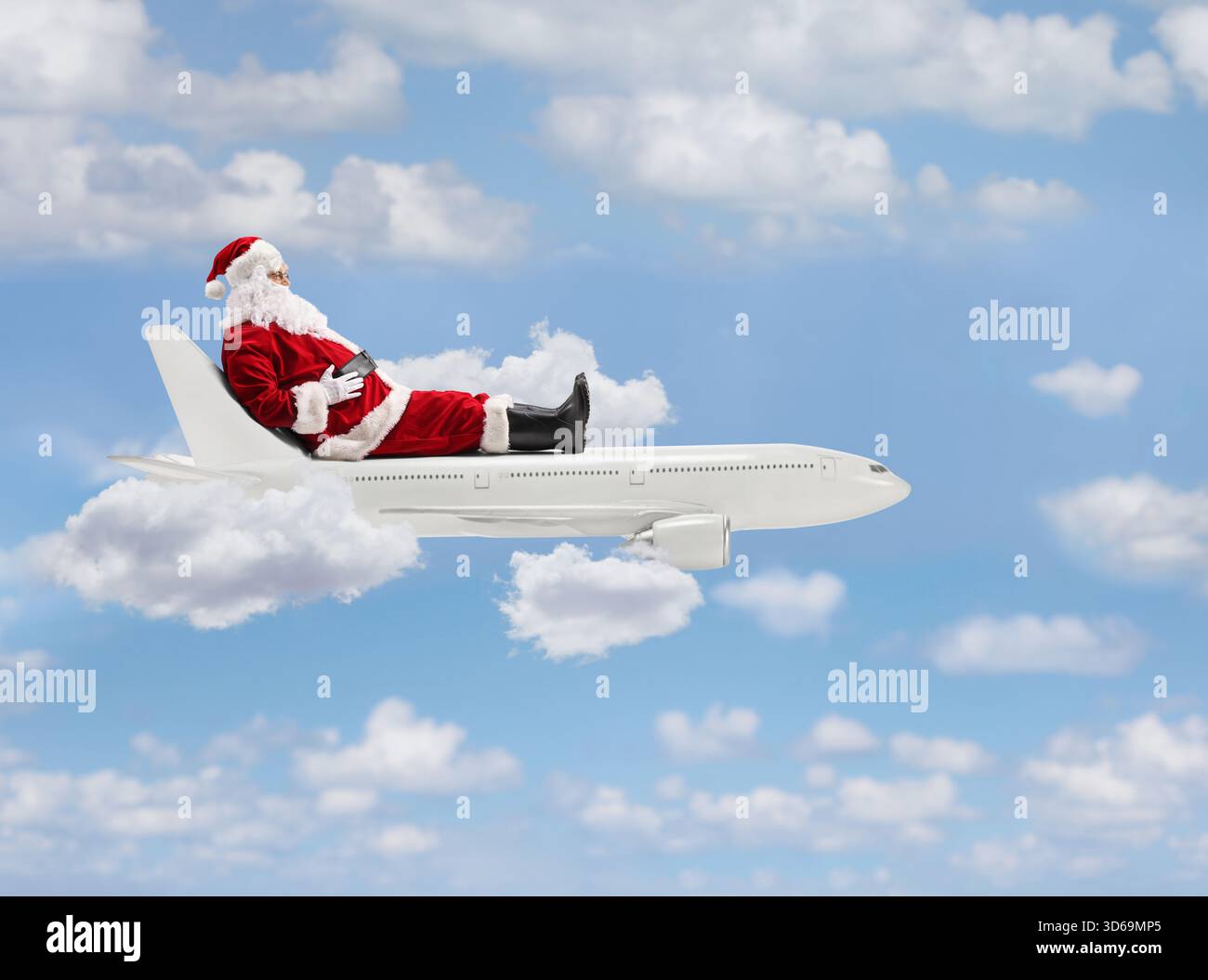 Santa Claus sitting on top of an airplane and flying in the sky Stock ...
