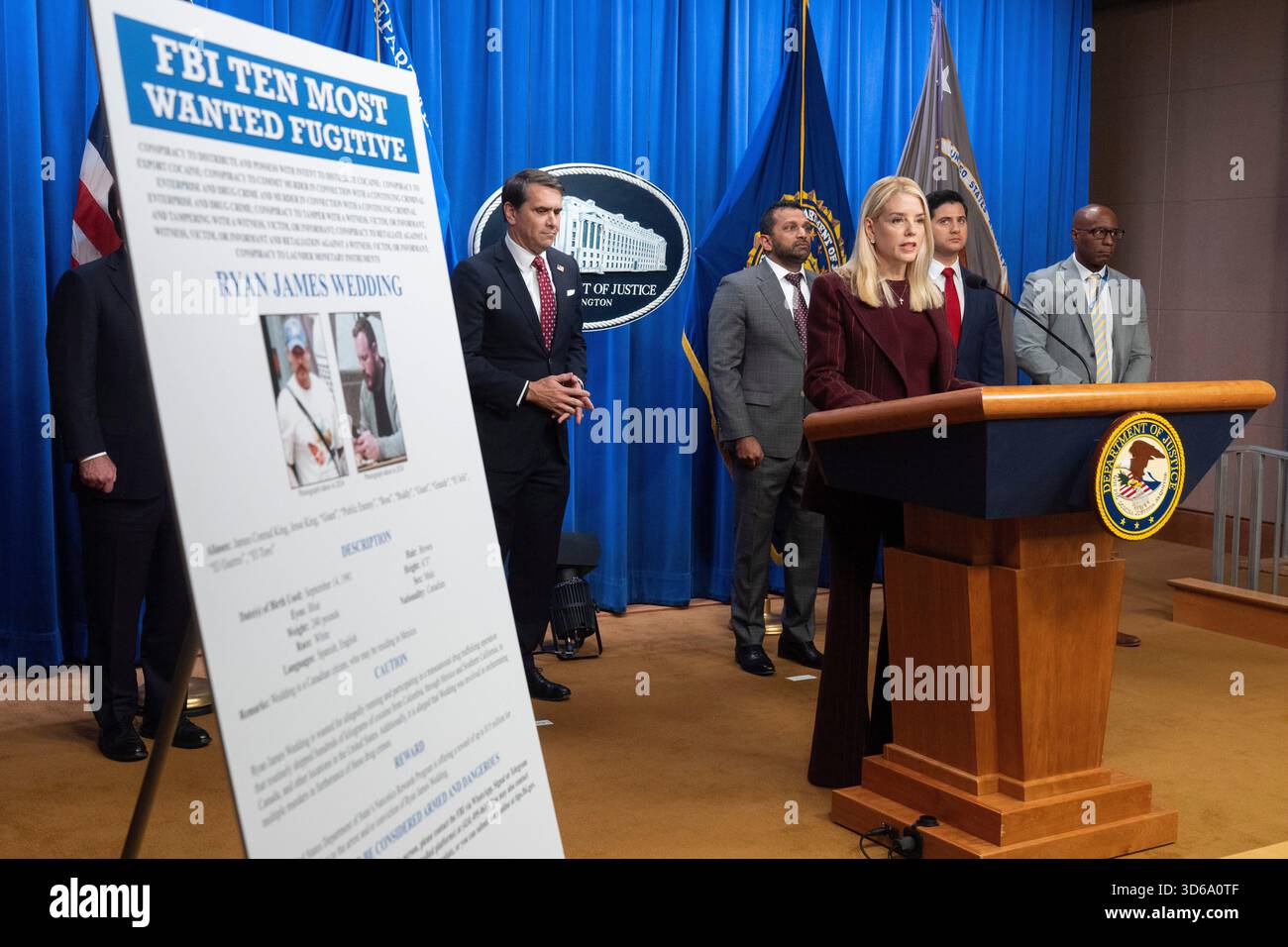 Attorney General Pam Bondi stands near wanted poster for Canadian ...