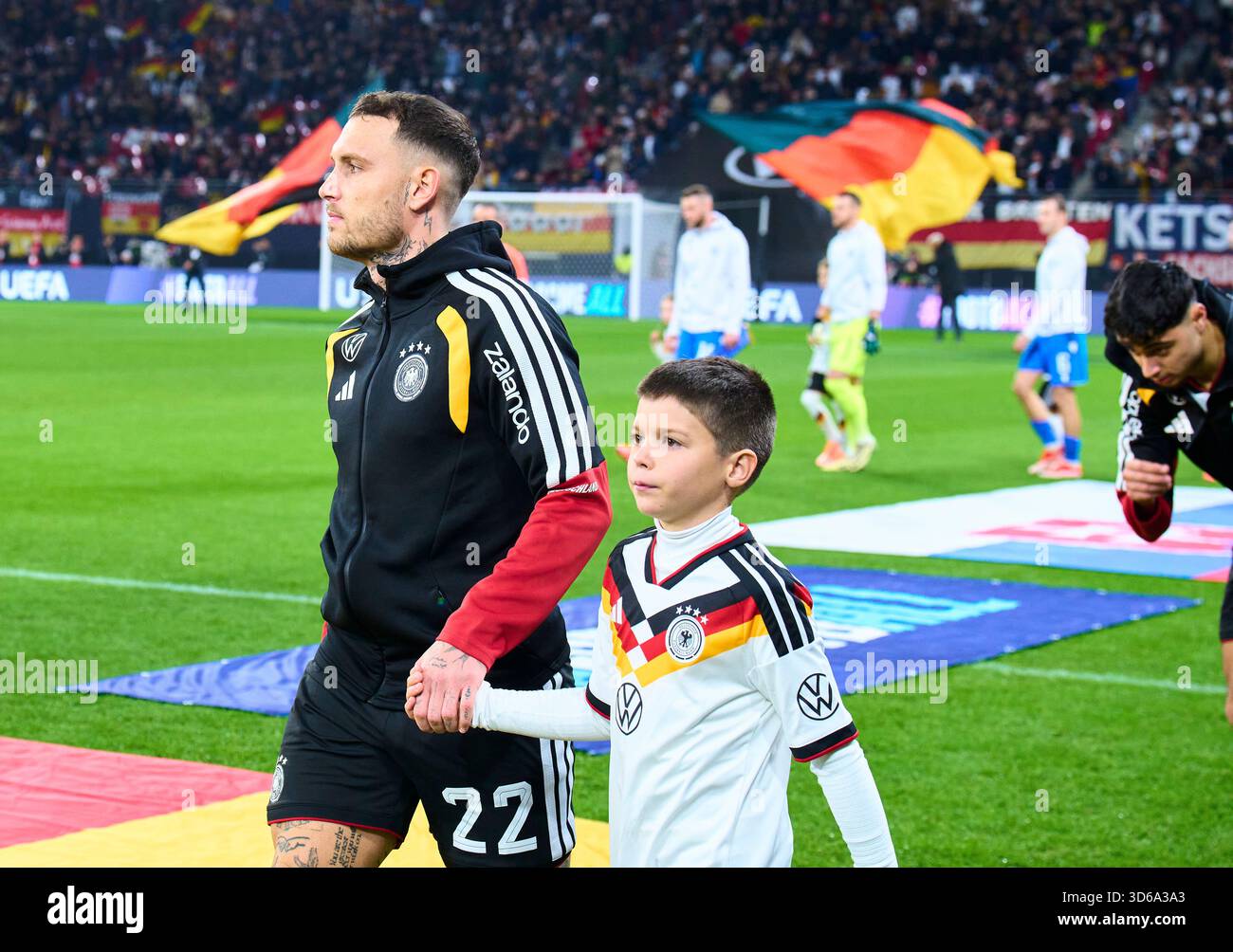 David Raum of Germany with soccer kid in the FIFA World Cup 2026 ...