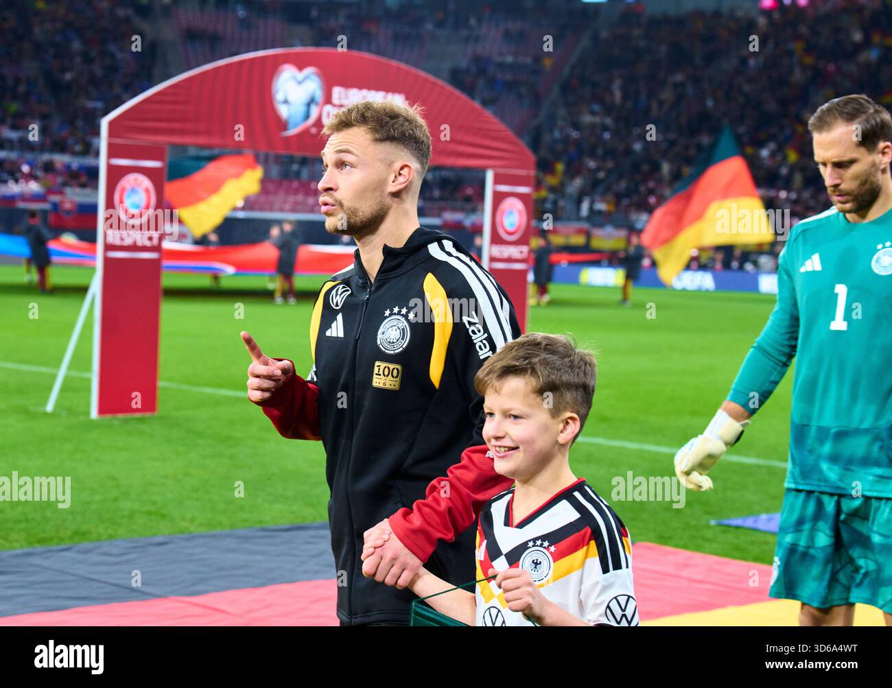 Joshua Kimmich of Germany with soccer kid in the FIFA World Cup 2026 ...