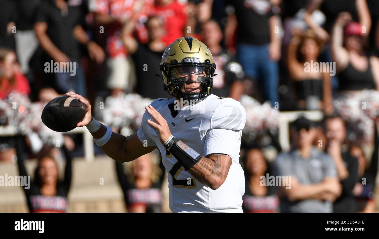 Central Florida quarterback Tayven Jackson (2) drops back to throw ...