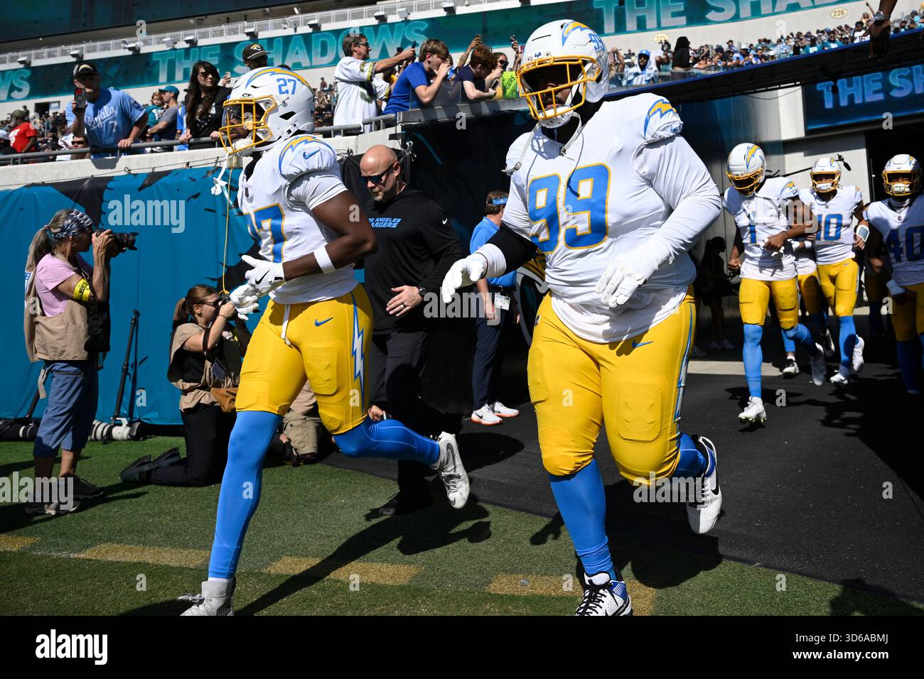 Los Angeles Chargers safety RJ Mickens (27) and defensive tackle ...