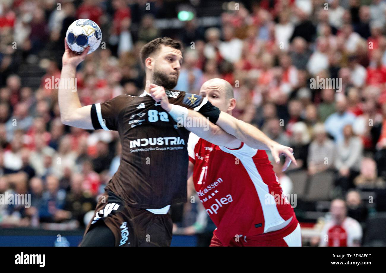 Kielce's Aleks Vlah and Aalborg Handball's Simon Hald Jensen, right, in ...