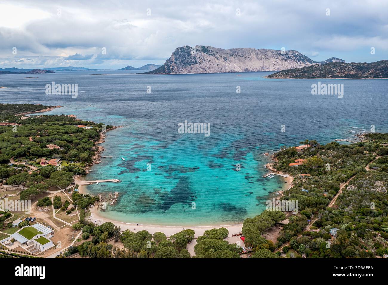 Turquoise Bay Cove With Clear Water, Pine Trees, and Mountain Island ...