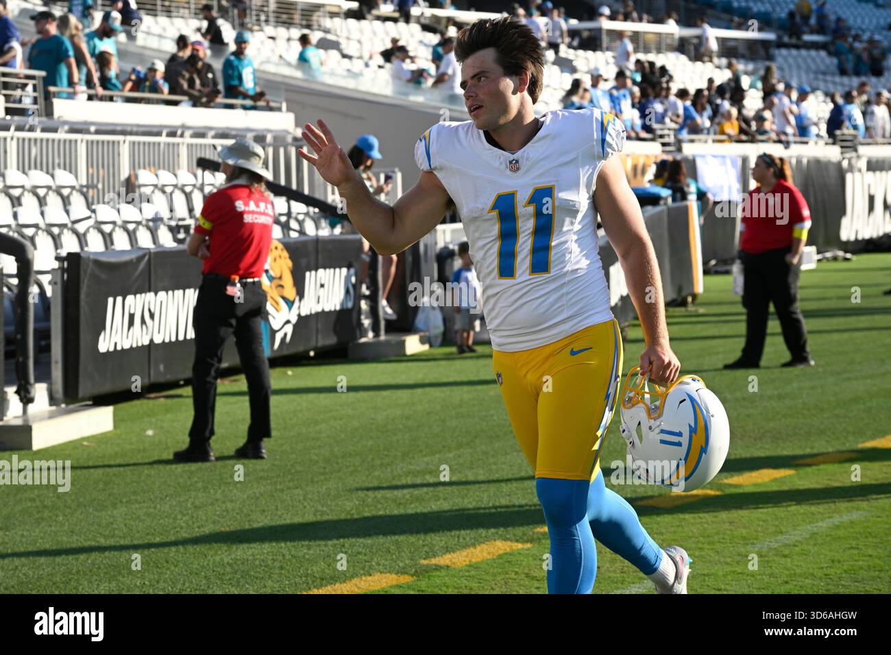 Los Angeles Chargers place kicker Cameron Dicker (11) leaves the field ...