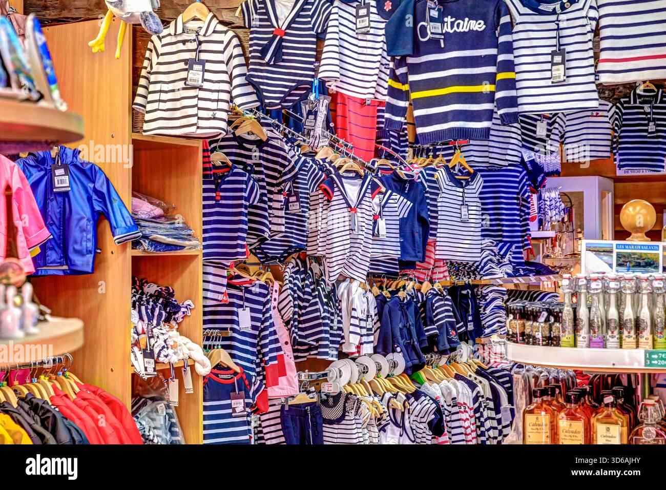 Colorful souvenir shop in Mont-Saint-Michel, France, displaying striped ...