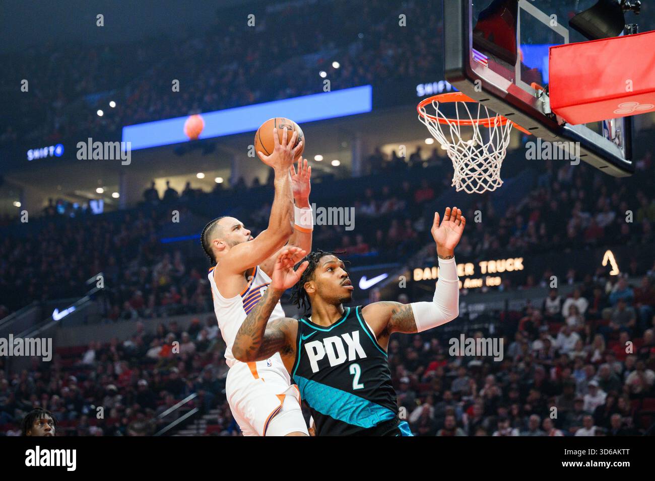 Phoenix Suns guard Dillon Brooks (3) goes up for a basket over Portland ...