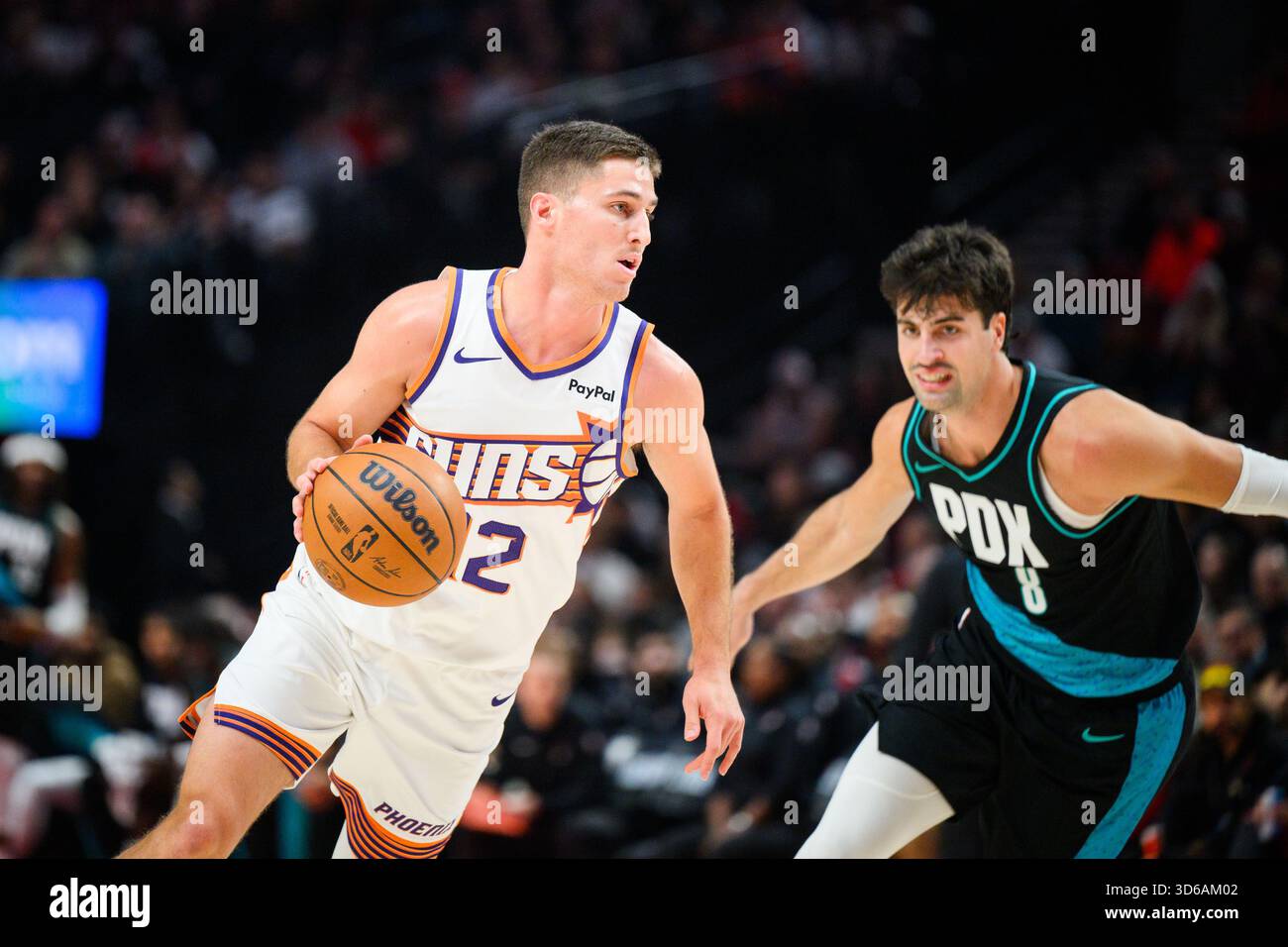 Phoenix Suns guard Collin Gillespie (12) drives past Portland Trail ...