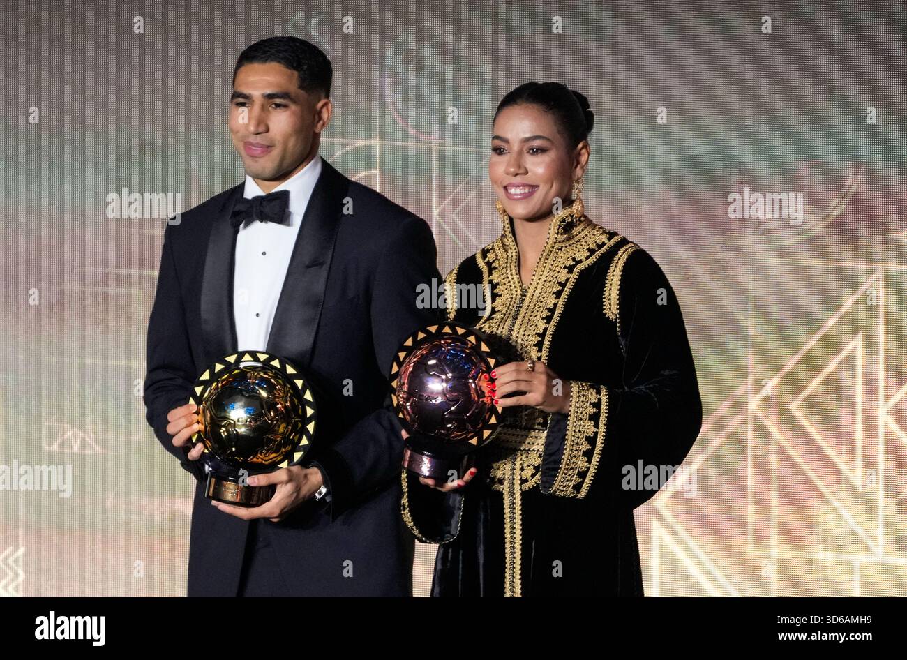 Morocco's Achraf Hakimi and Ghizlane Chebbak pose for a photo after ...