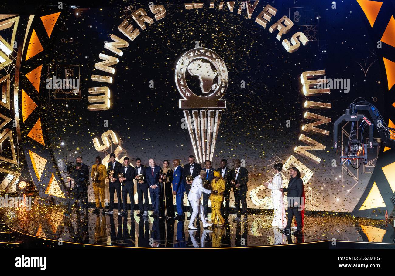 Winners pose for a group photo at the CAF Awards 2025 ceremony in which ...