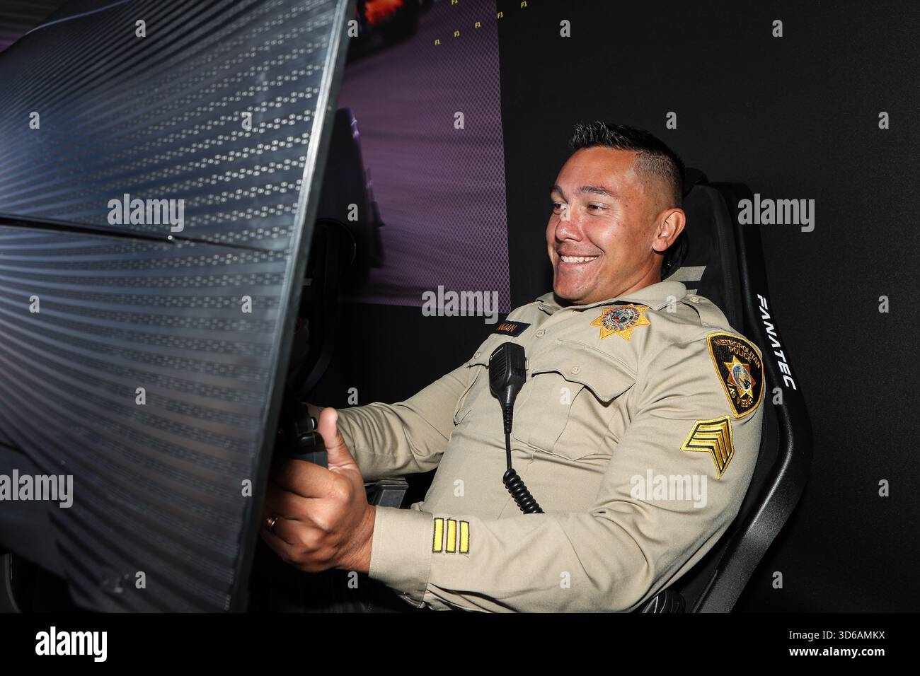 November 19, 2025: A LVMPD officer participates in the F1 simulator ...