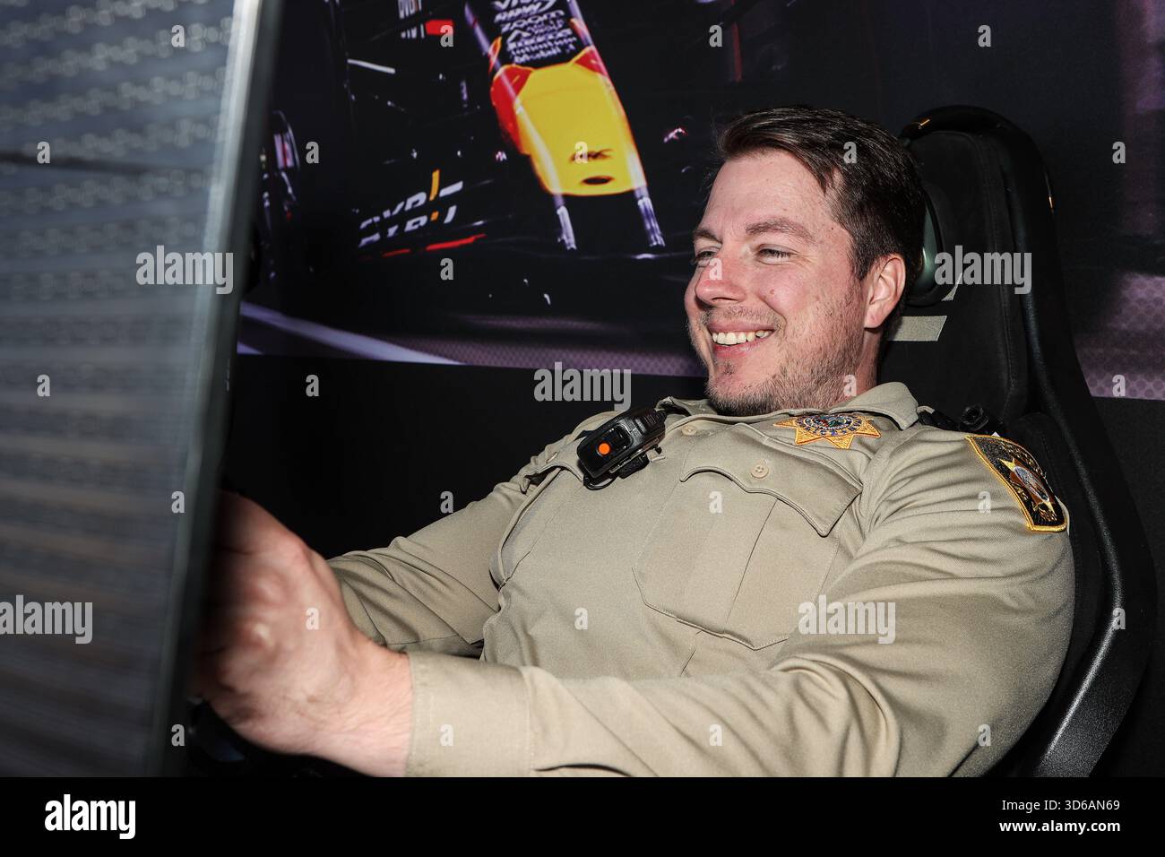 November 19, 2025: A LVMPD officer participates in the F1 simulator ...